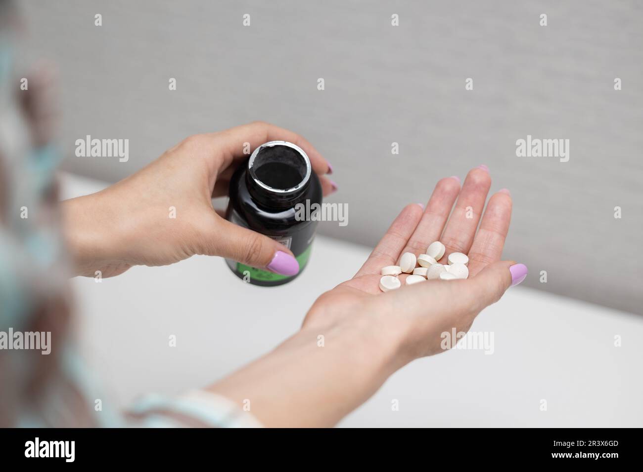 Woman pouring pills from hi-res stock photography and images - Alamy