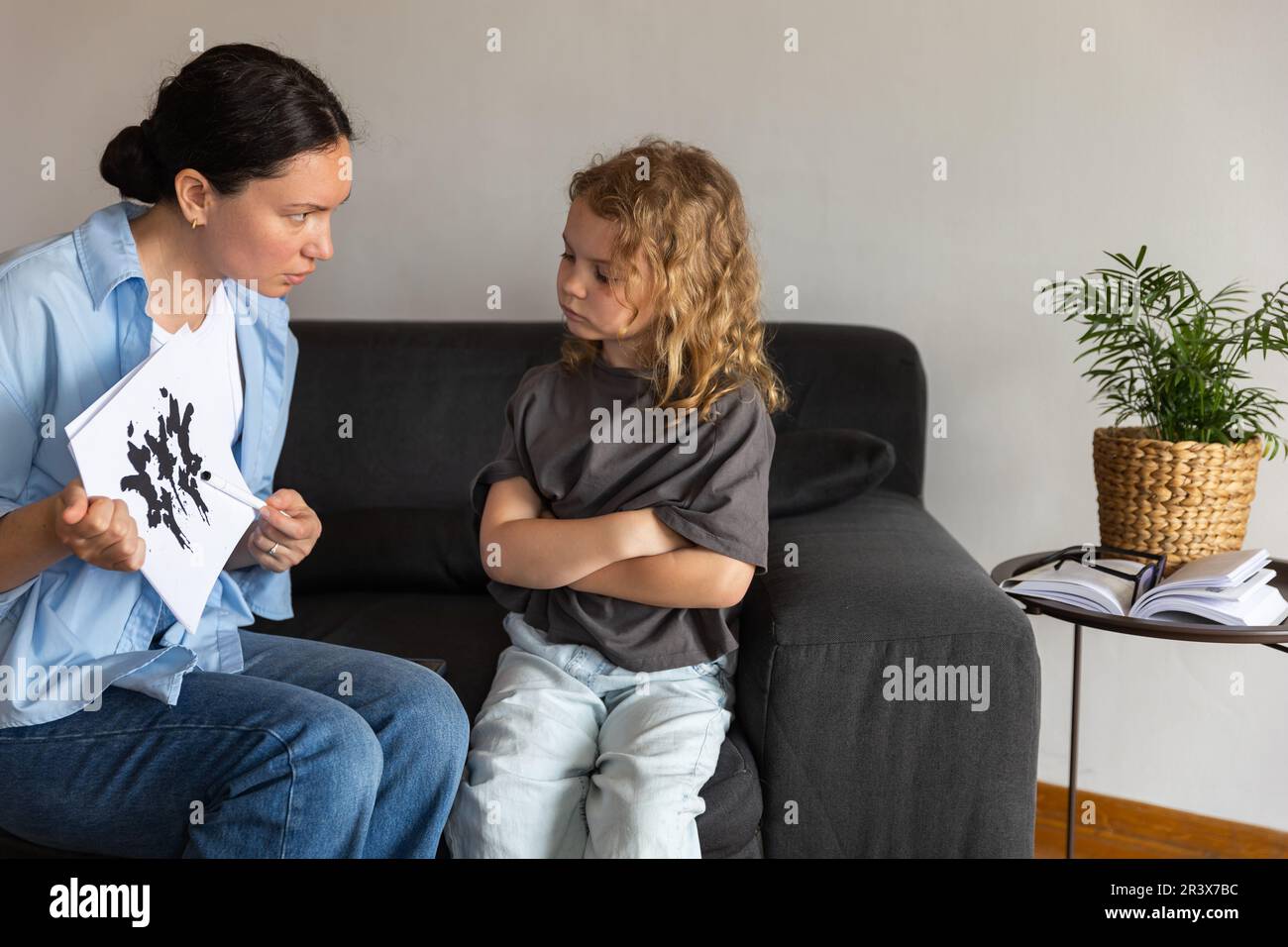 A child girl at a psychotherapist's appointment undergoes psychological ...