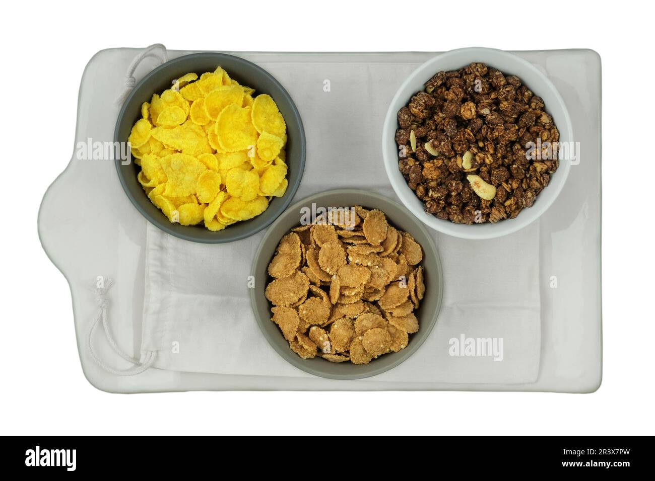 Variety of breakfast cereals and muesli in bowls isolated on white ...