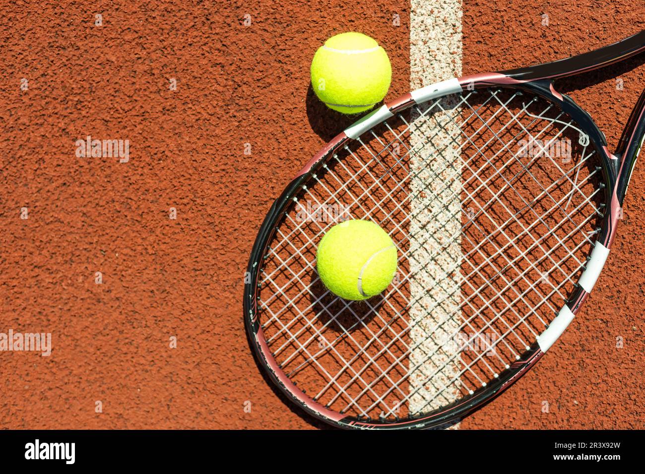 tennis racket with a tennis ball on a tennis court Stock Photo - Alamy