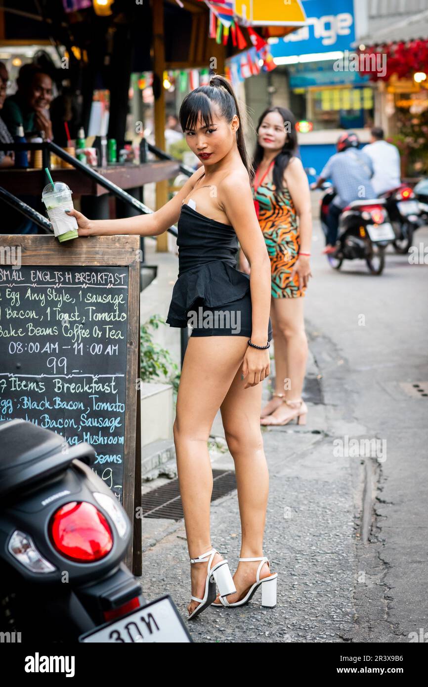 A beautiful young Thai woman strikes a pose outside her bar in Pattaya Thailand Stock Photo - Alamy