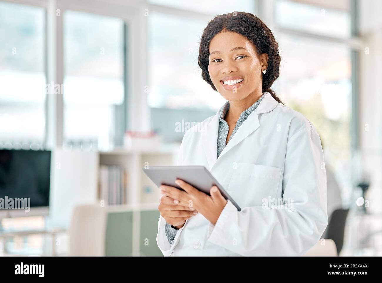 Black woman, tablet and portrait of a scientist in laboratory, hospital ...