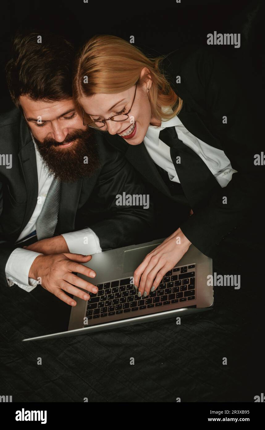 Business people meeting deadline. Young happy positive couple ...