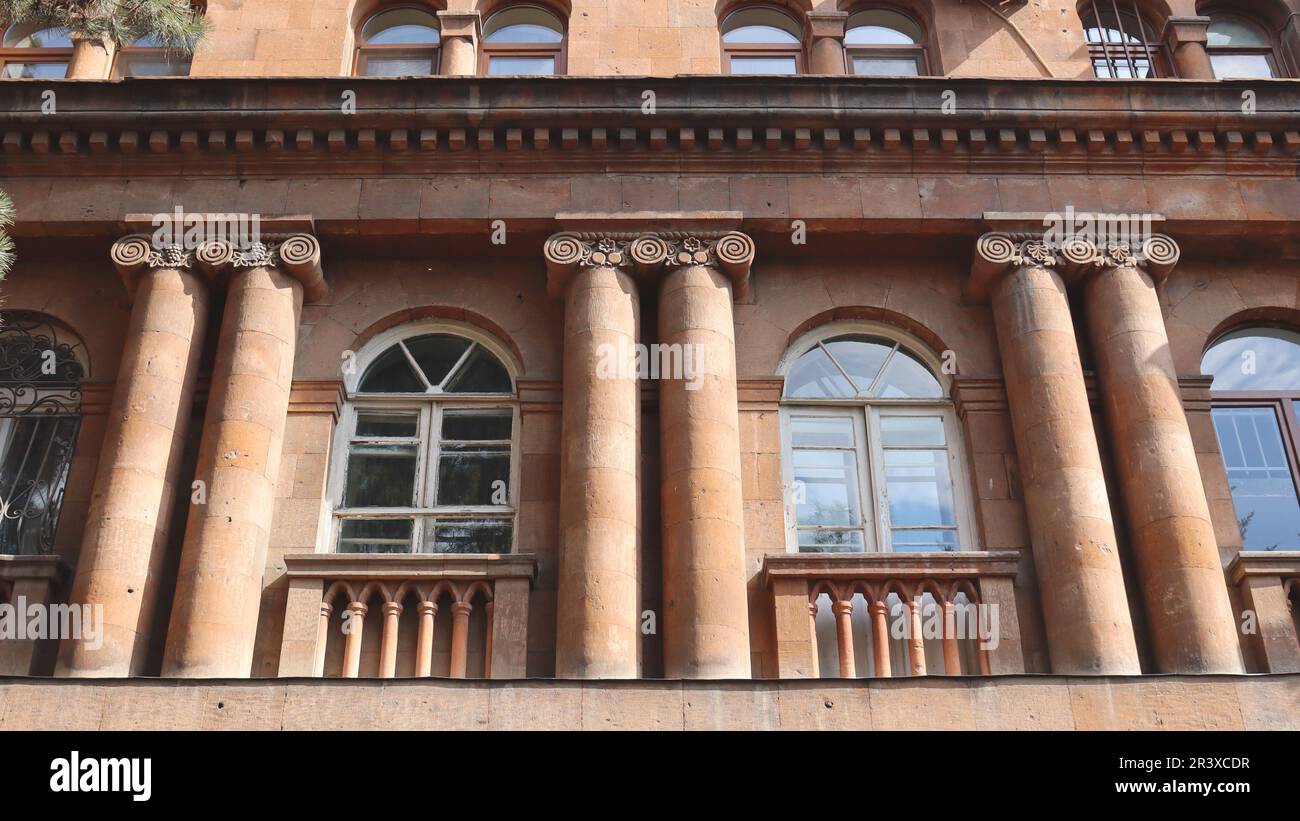 Close up front view of the old building in Yerevan concept photo. Urban architectural ...