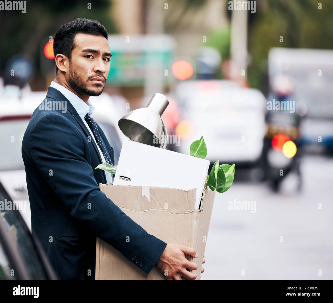 Depression, economy and a fired business man carrying a box while ...