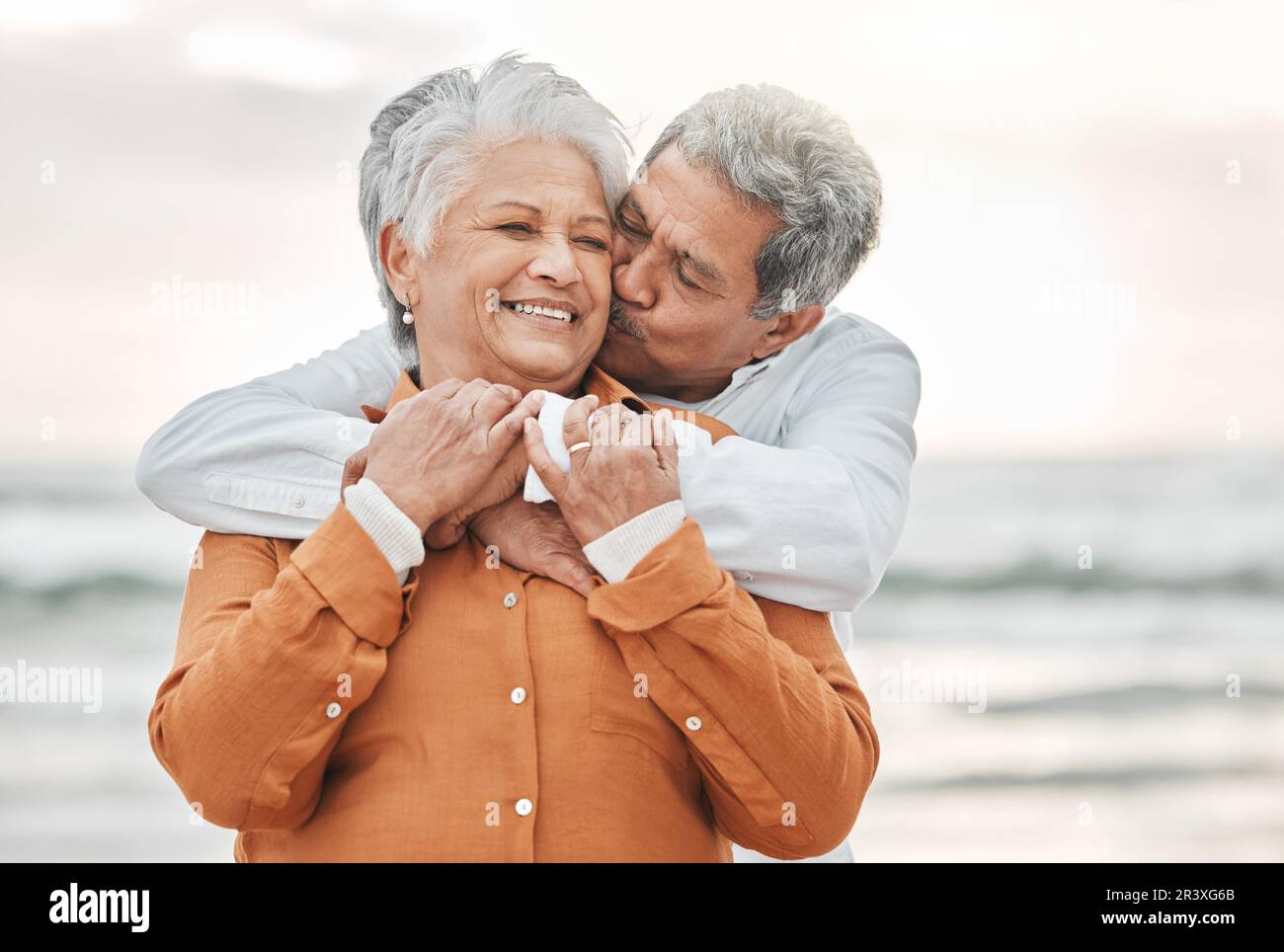Happy Senior Couple Hug And Beach With Smile Bonding And Kiss On