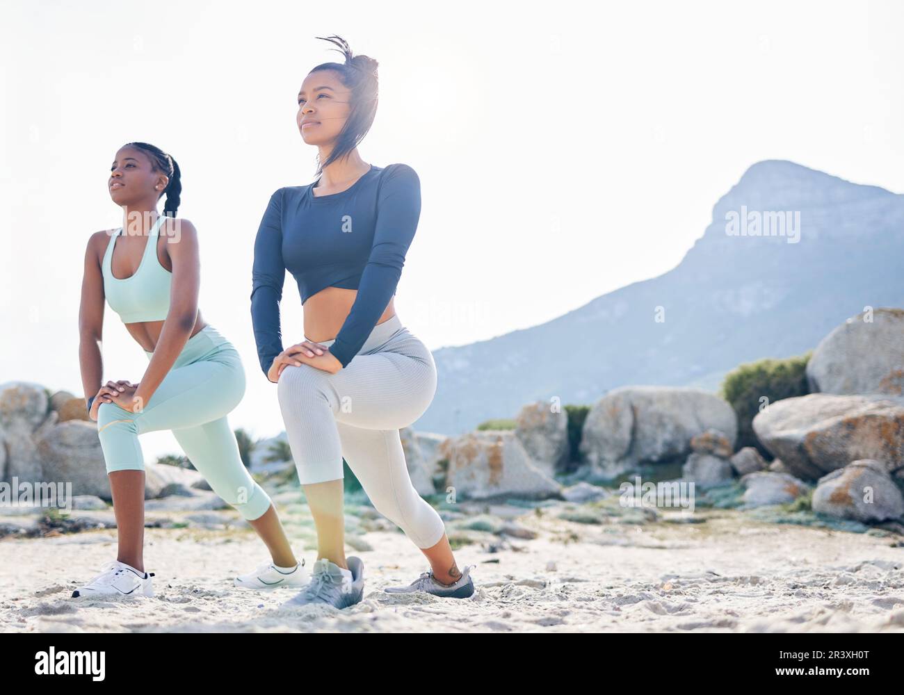 Stretching, fitness and friends with women at beach for running, yoga ...