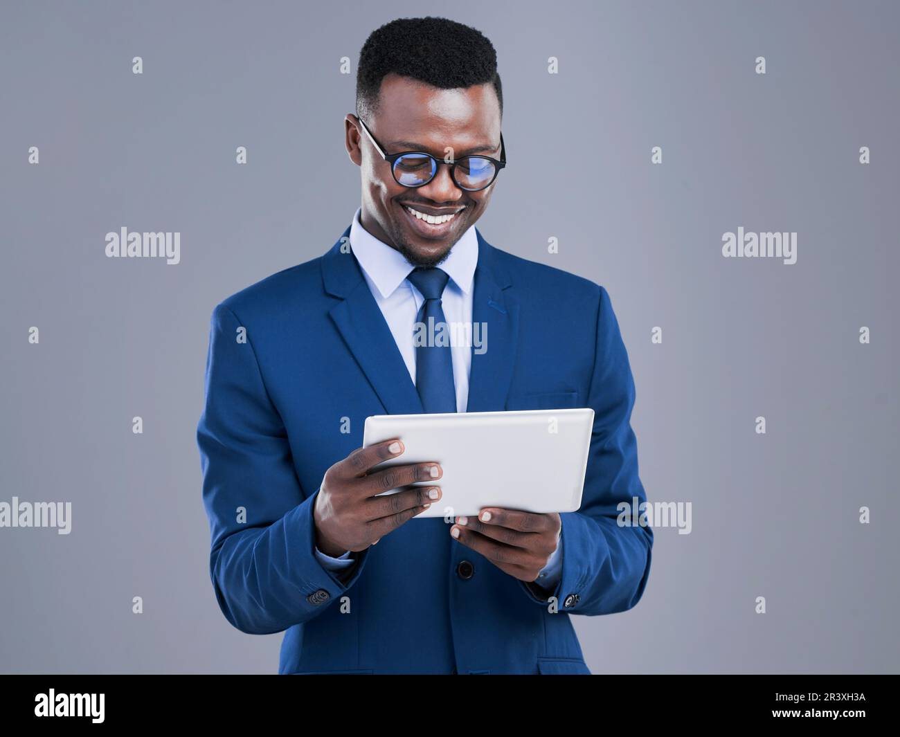 Black man, tablet and business analyst in a studio with technology ...