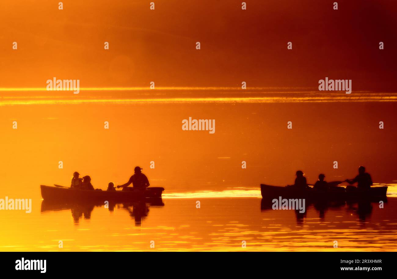 Canoeing at sunset hi-res stock photography and images - Alamy