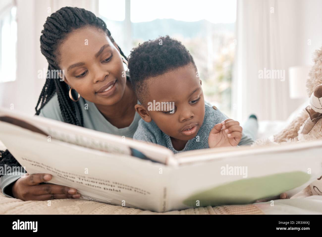 Black family, mother and child reading book for learning, storytelling ...