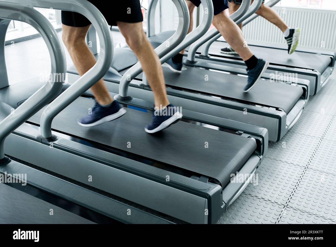 Gym shot - people running on machines, treadmill with motion blur Stock ...