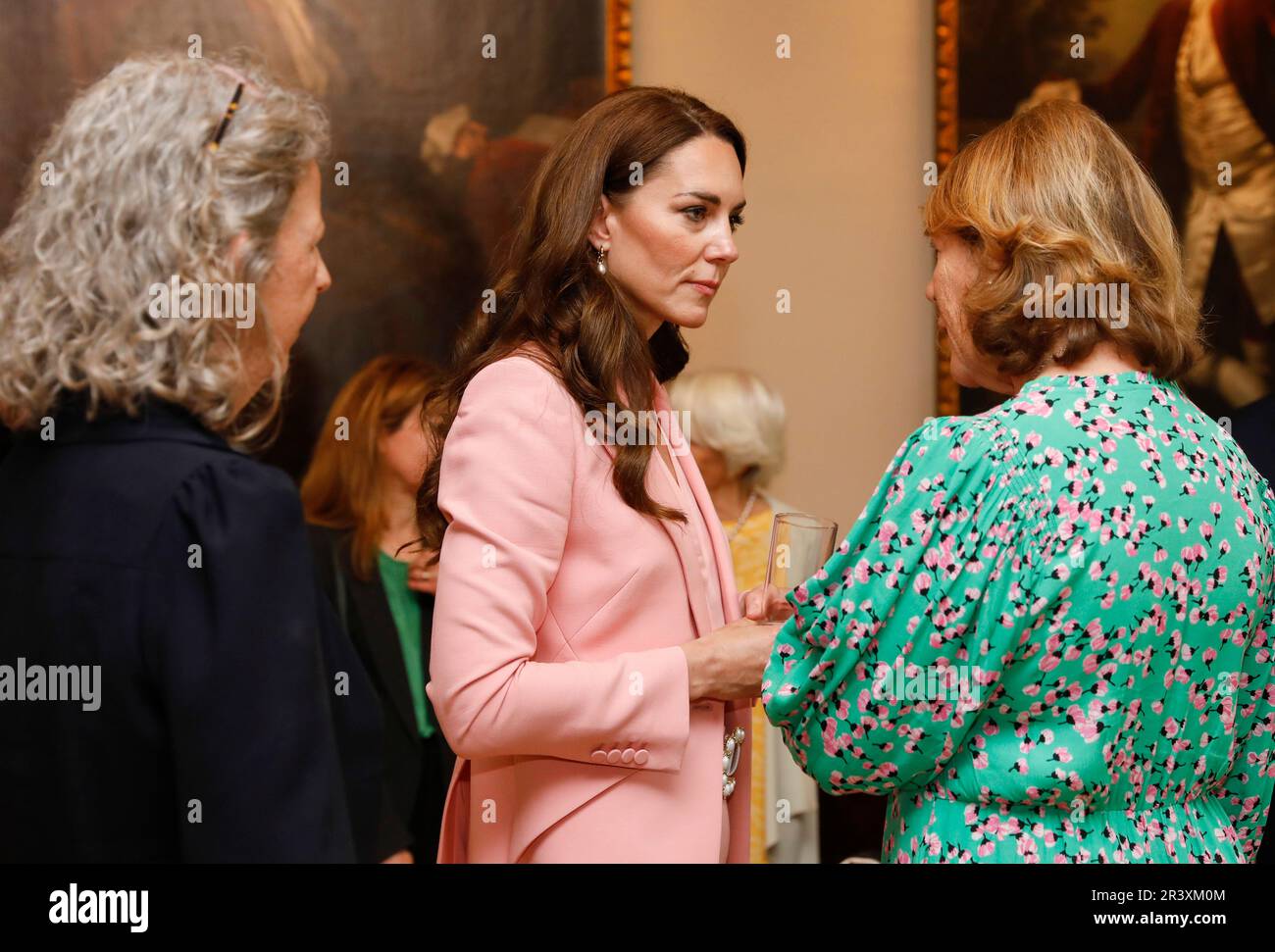 Britain's Kate, the Princess of Wales, centre, listens, during a visit ...