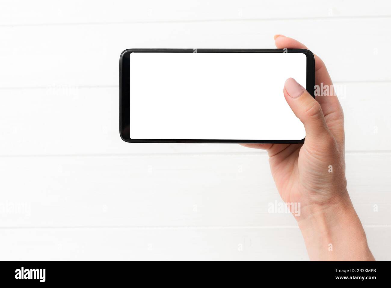Template of using black smartphone on white table background for your ...