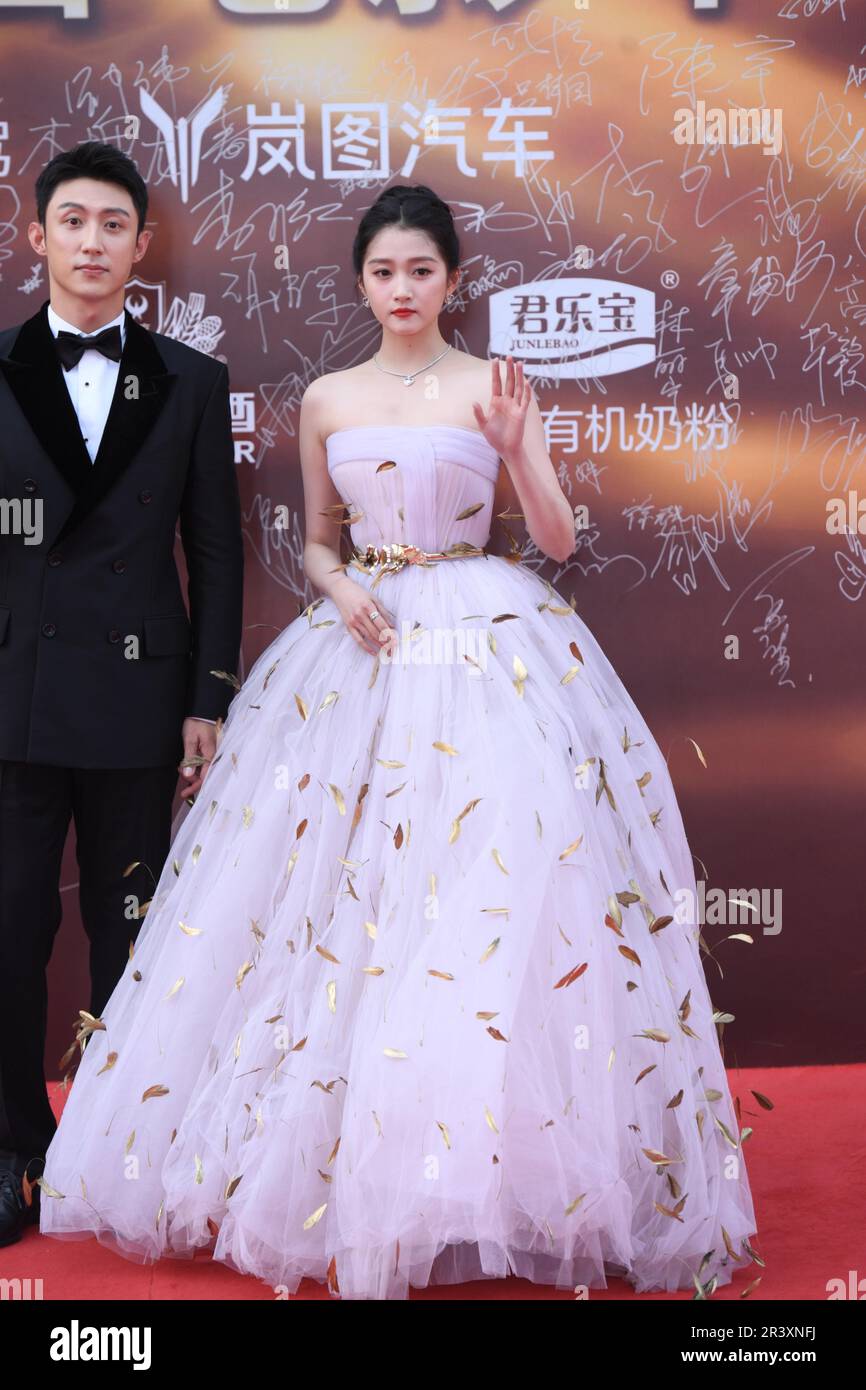 Chinese actress and singer Guan Xiaotong, Chinese actor and model Huang Jingyu pose for a photo ...