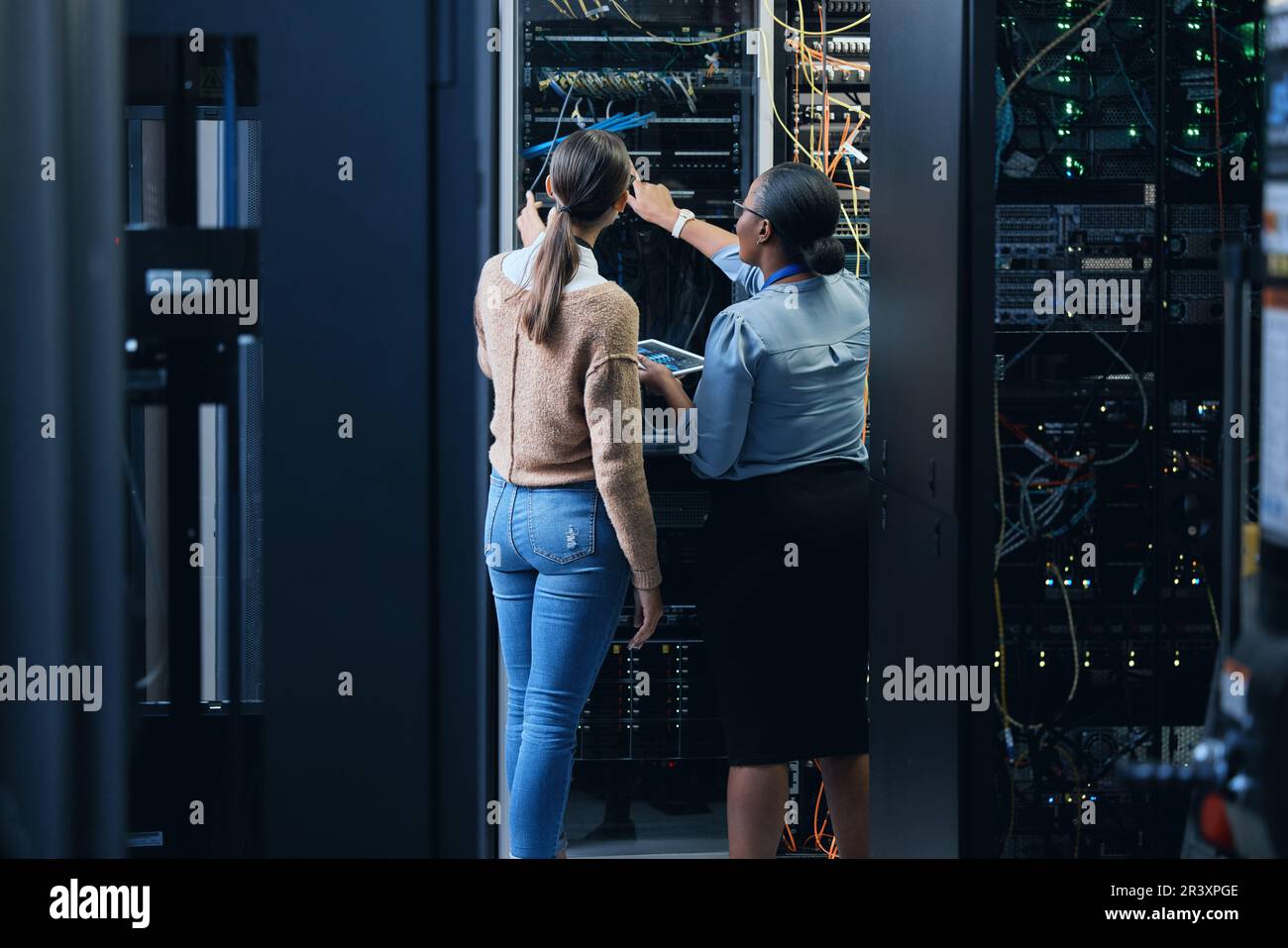 Server room, engineer and women team with tablet for programming ...