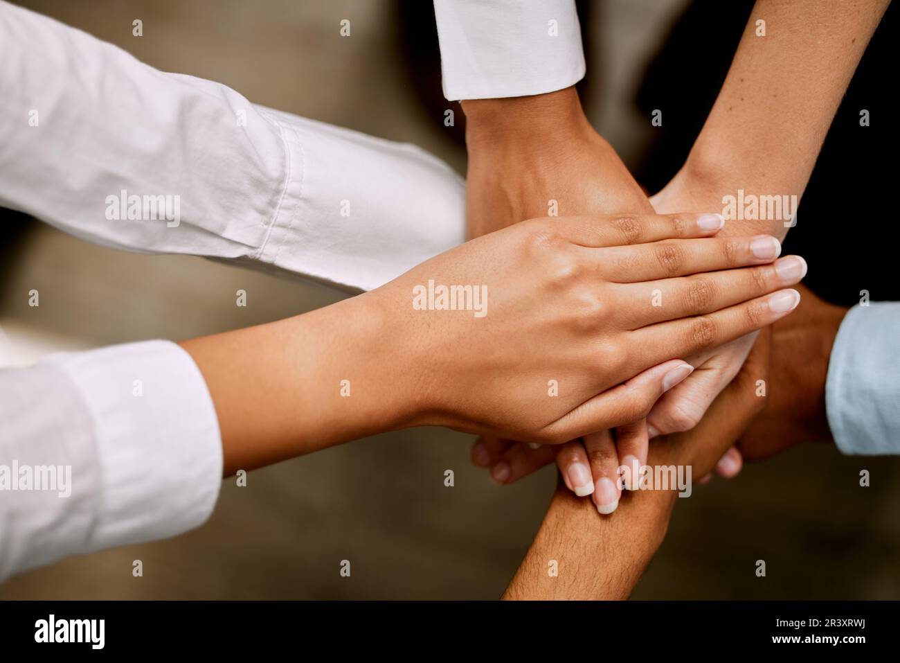 Hands stacked, teamwork and group of people for support, collaboration ...