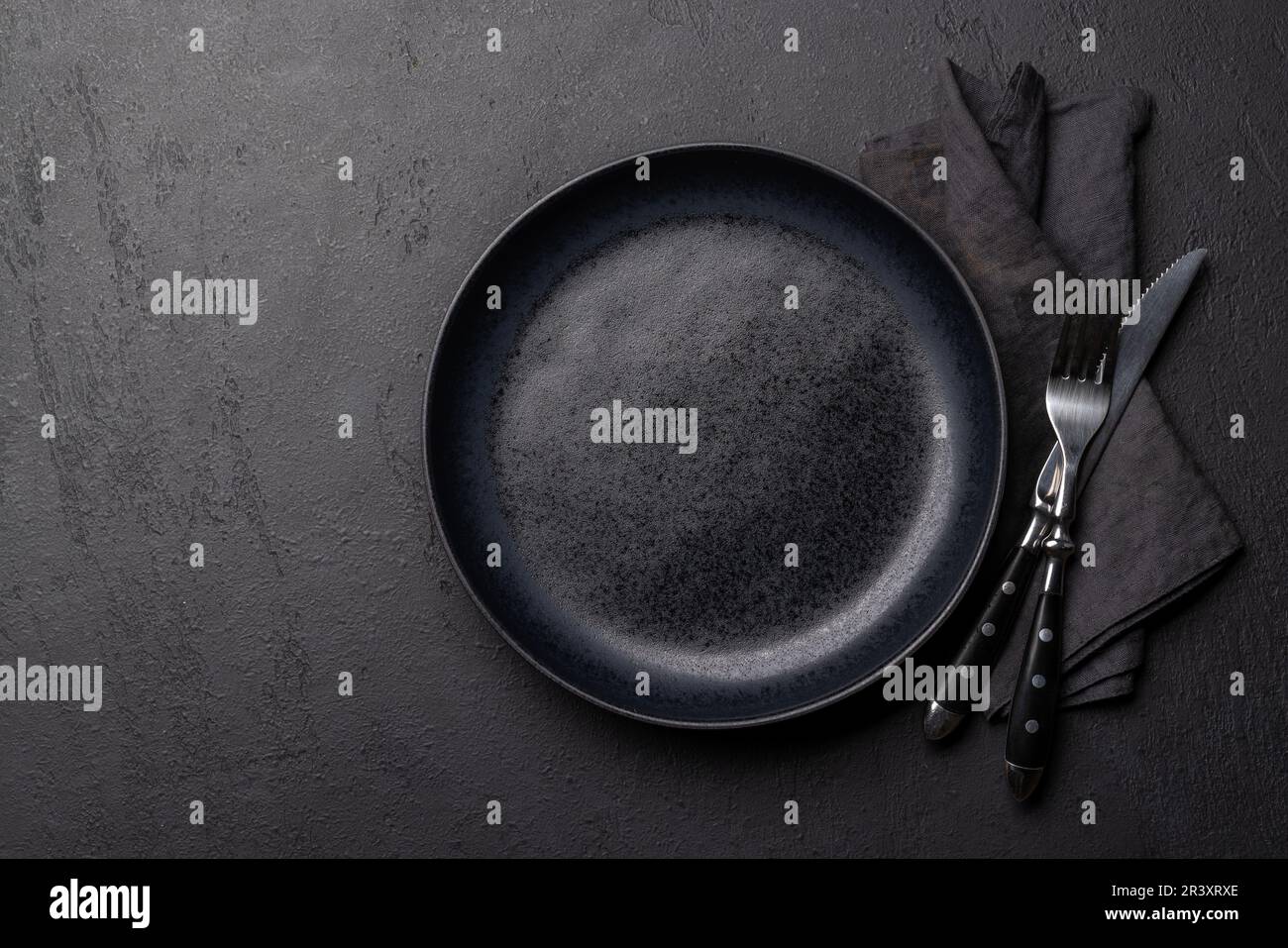 Top-down view of an empty plate and silverware mockup, perfect for ...