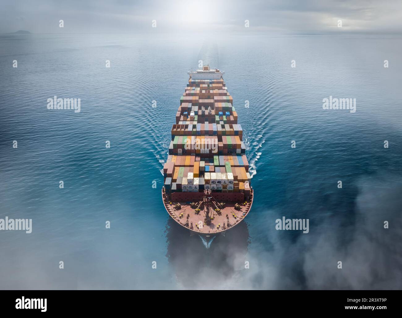 Aerial top view of a big cargo container ship in fog Stock Photo - Alamy