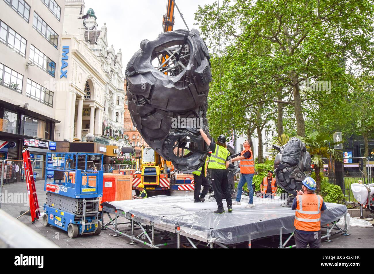 London, England, UK. 25th May, 2023. Workers install a huge Transformer ...