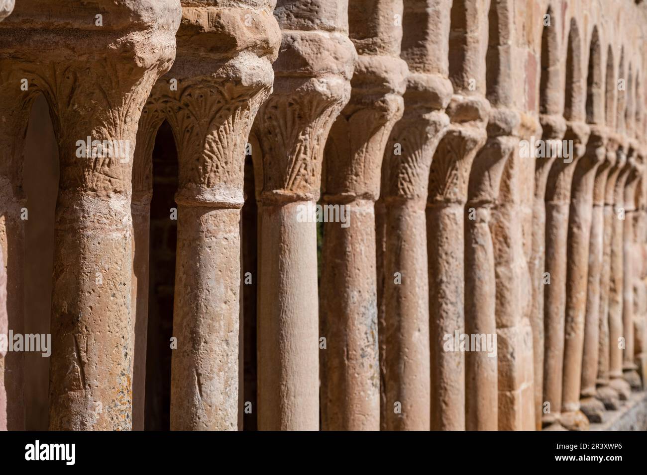 Arcaded gallery of semicircular arches on paired columns Stock Photo - Alamy