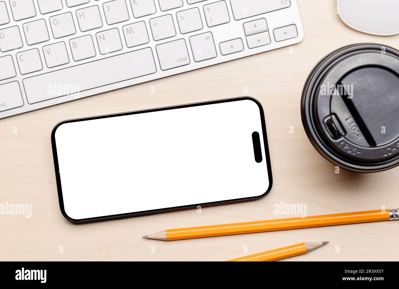 Blank white screen smartphone on a desk, perfect for your design mockup ...