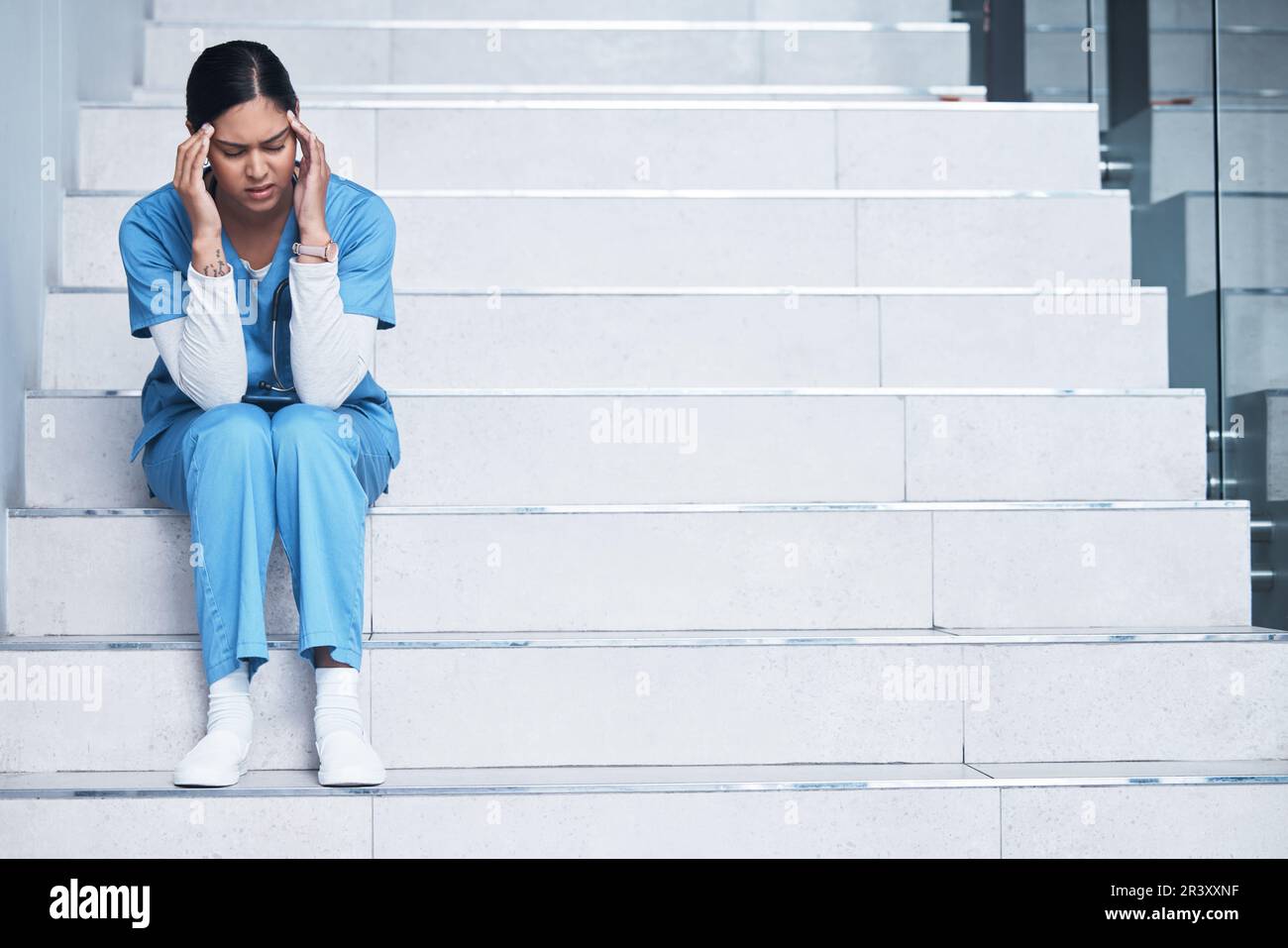 Stress, headache and tired with nurse in hospital for burnout, mental ...