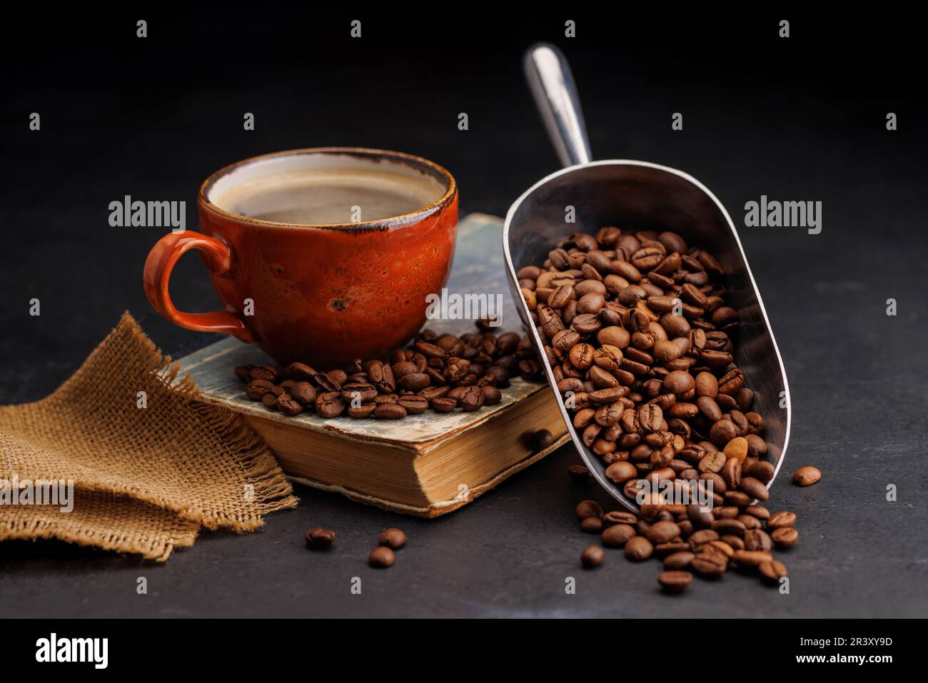 Rich coffee in a cup with aromatic roasted beans, a perfect morning ...