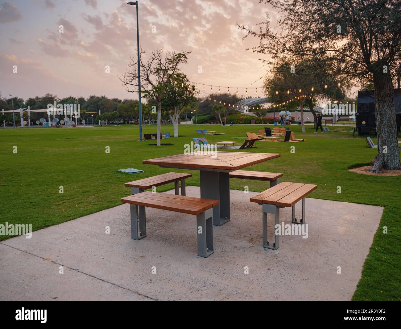 Large green evening park in the big city, Umm Al Emarat Park in Abu ...