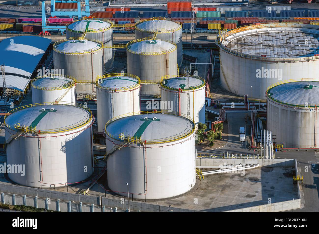 Big white oil tanks in the harbor of Barcelona Stock Photo - Alamy