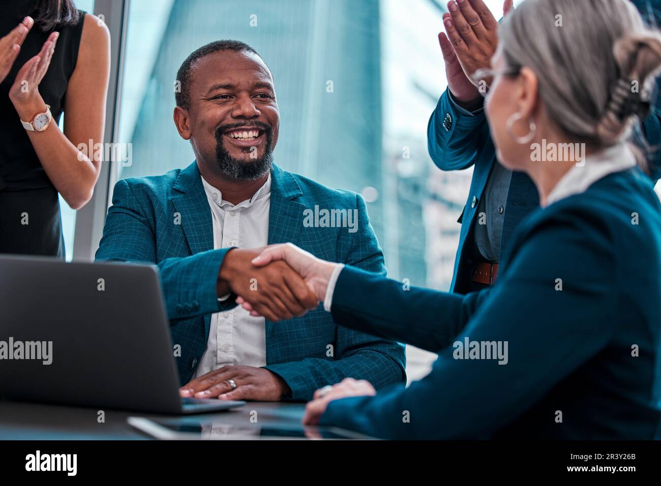 Hiring success, meeting and business people with a handshake with applause at work. Happy ...