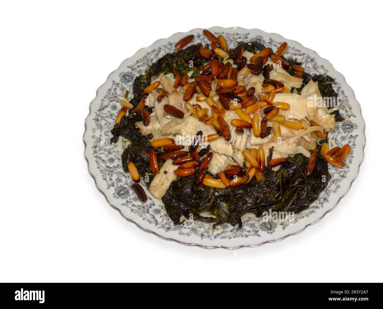 A dish of Molokhiya with chicken meat served with bread. a traditional ...