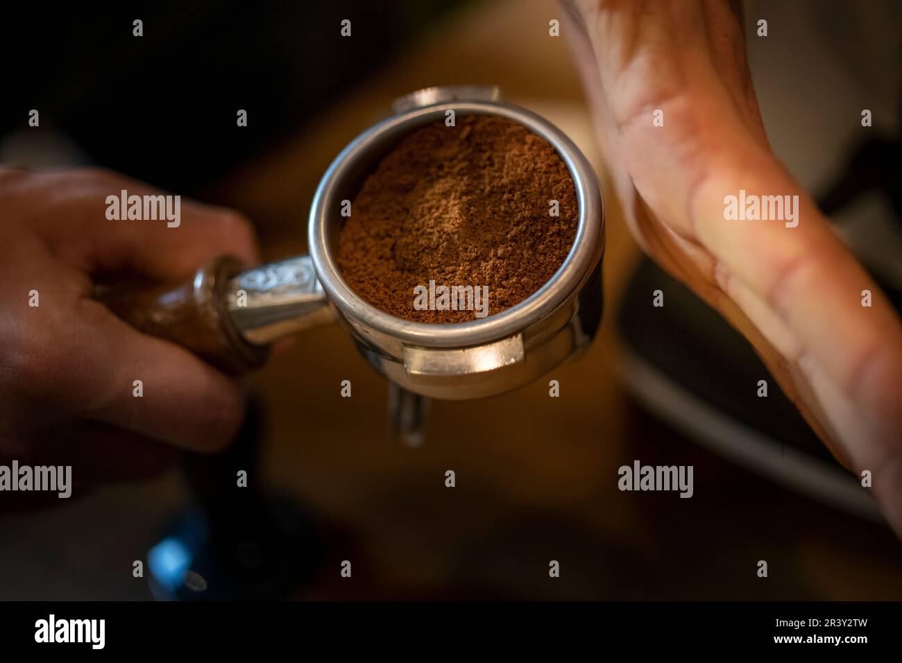 Coffee prep, the home Barista making Espresso using a Grinding Machine ...
