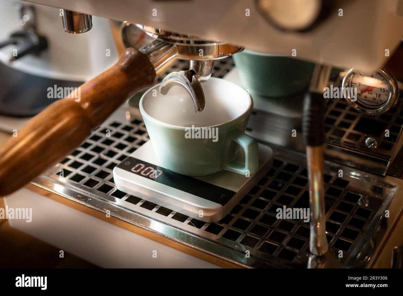 Coffee prep, the home Barista making Espresso using a Grinding Machine ...