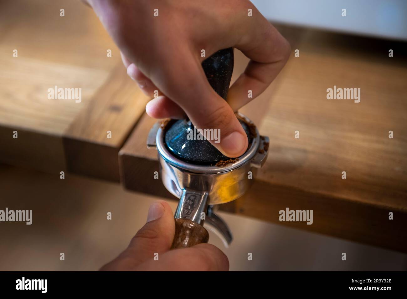 Coffee prep, the home Barista making Espresso using a Grinding Machine ...