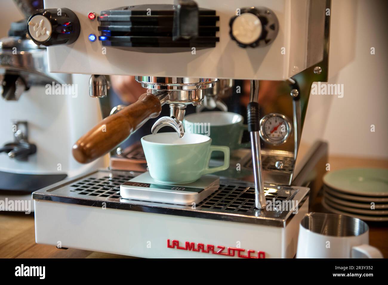 Coffee prep, the home Barista making Espresso using a Grinding Machine ...