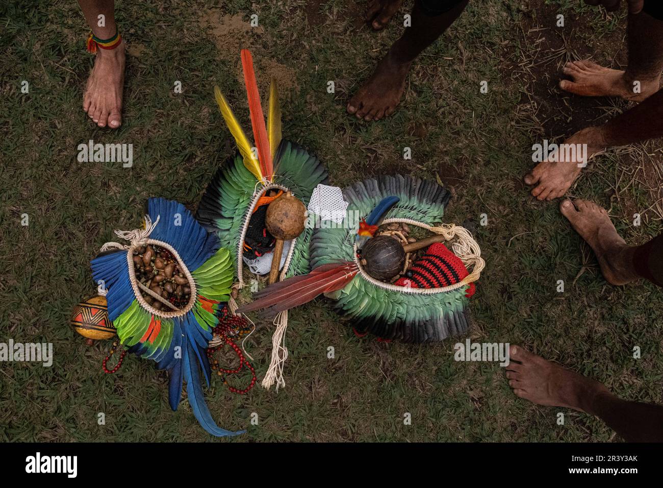 The head ornaments (cocar) and music instruments seen laying on the ...