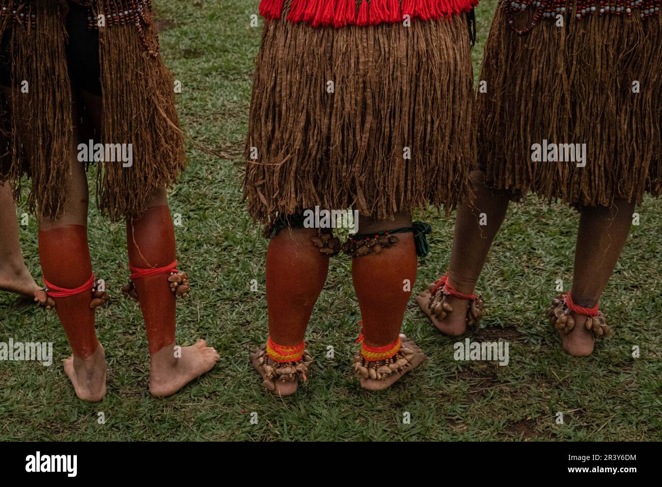 Details of the legs and feet of indigenous women wearing traditional ...