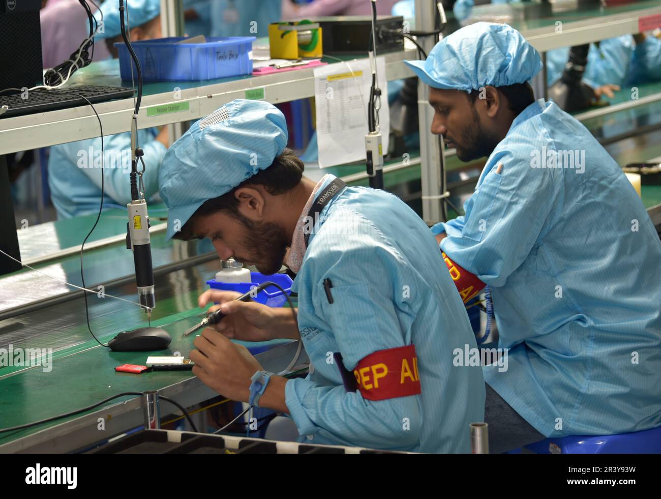 Dhaka. 25th May, 2023. Workers work at the new factory of Transsion ...