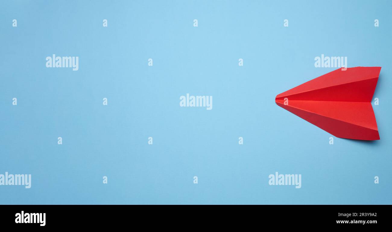 Red paper airplane on a blue background, travel concept, top view Stock ...