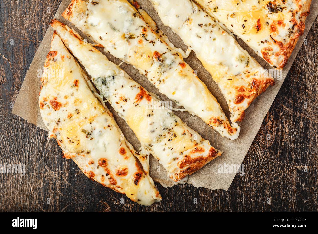 Roman-style pizzas with cheese. Roman square pizza or Pinsa on a thick ...