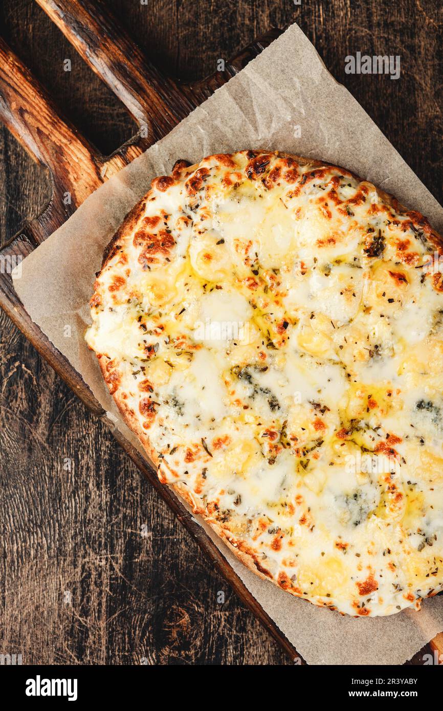 Roman-style pizzas with cheese. Roman square pizza or Pinsa on a thick ...