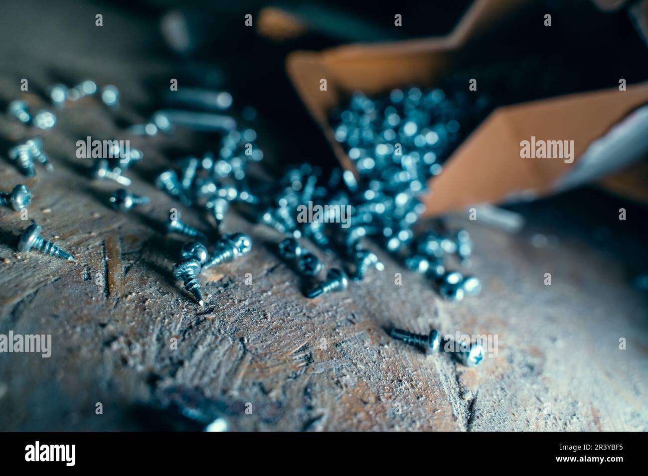 Shiny small self-tapping screws for the metal profile crumbled out of ...