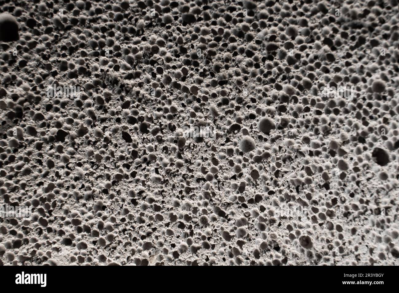 The texture of aerated concrete close-up. Abstract background of ...