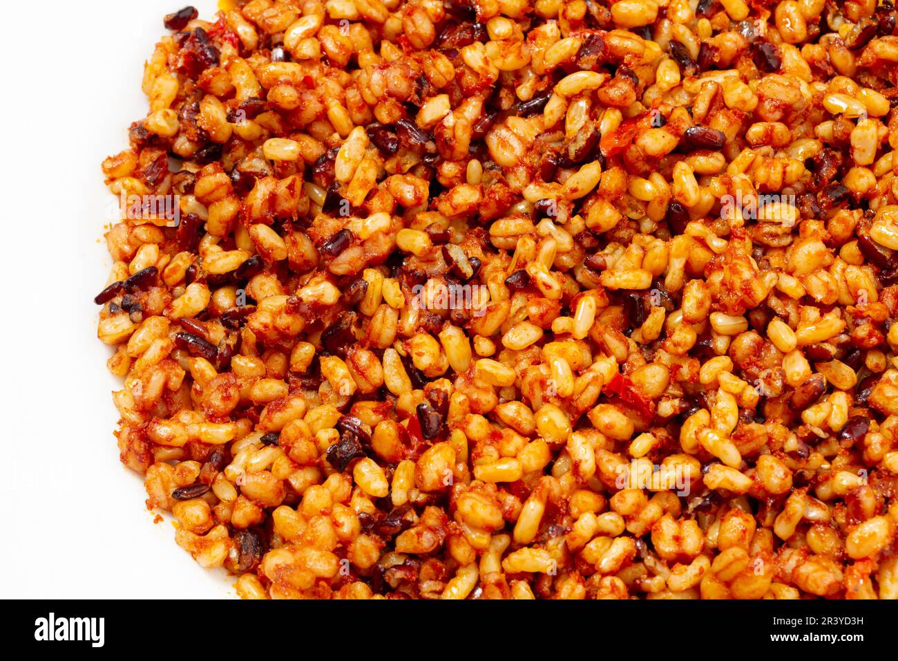 Spanish style grains with rice, red pepper and paprika Stock Photo - Alamy