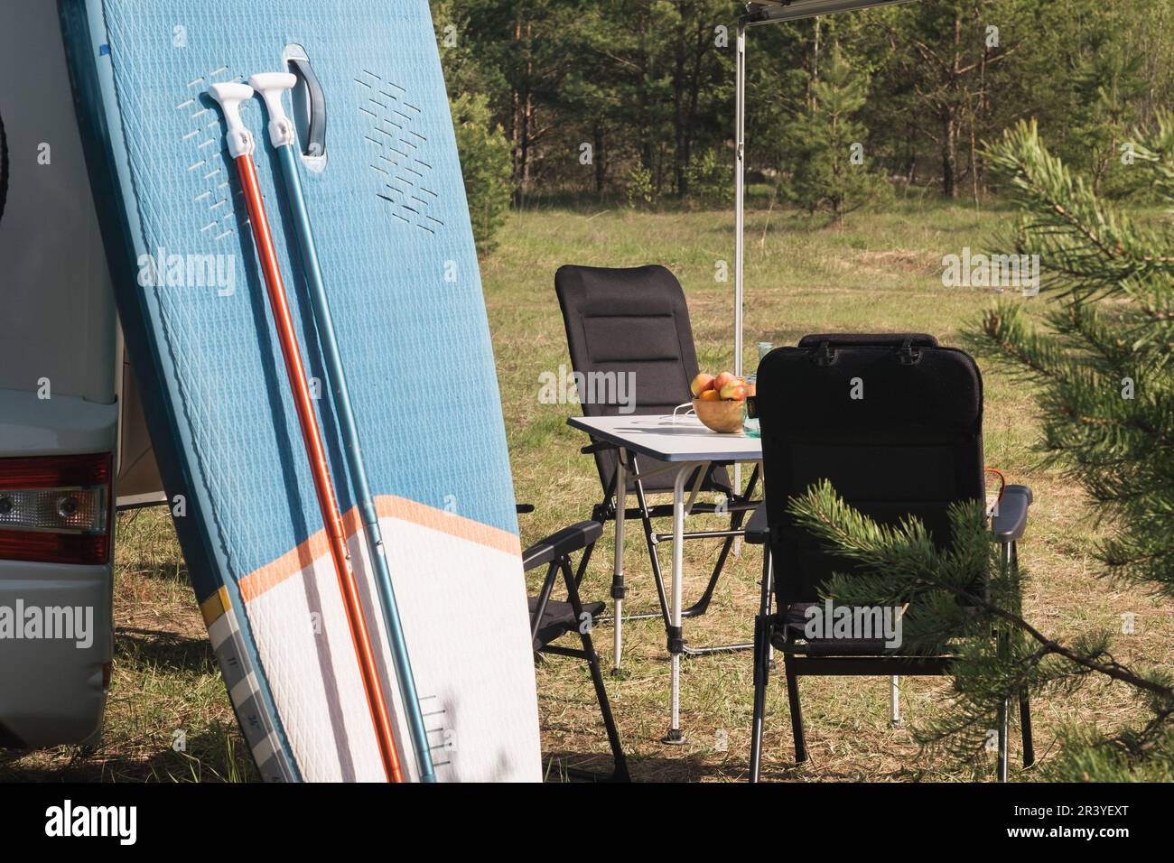 Inflatable Sup rowing boards stand near the motorhome inflated in ...