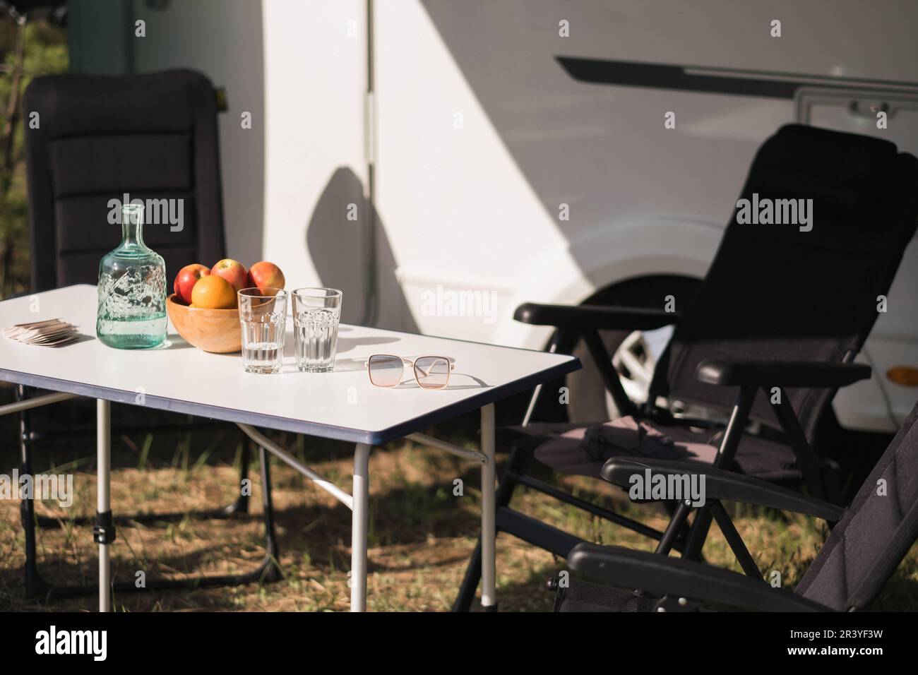 Outdoor Chairs and picnic table near the motorhome Stock Photo - Alamy