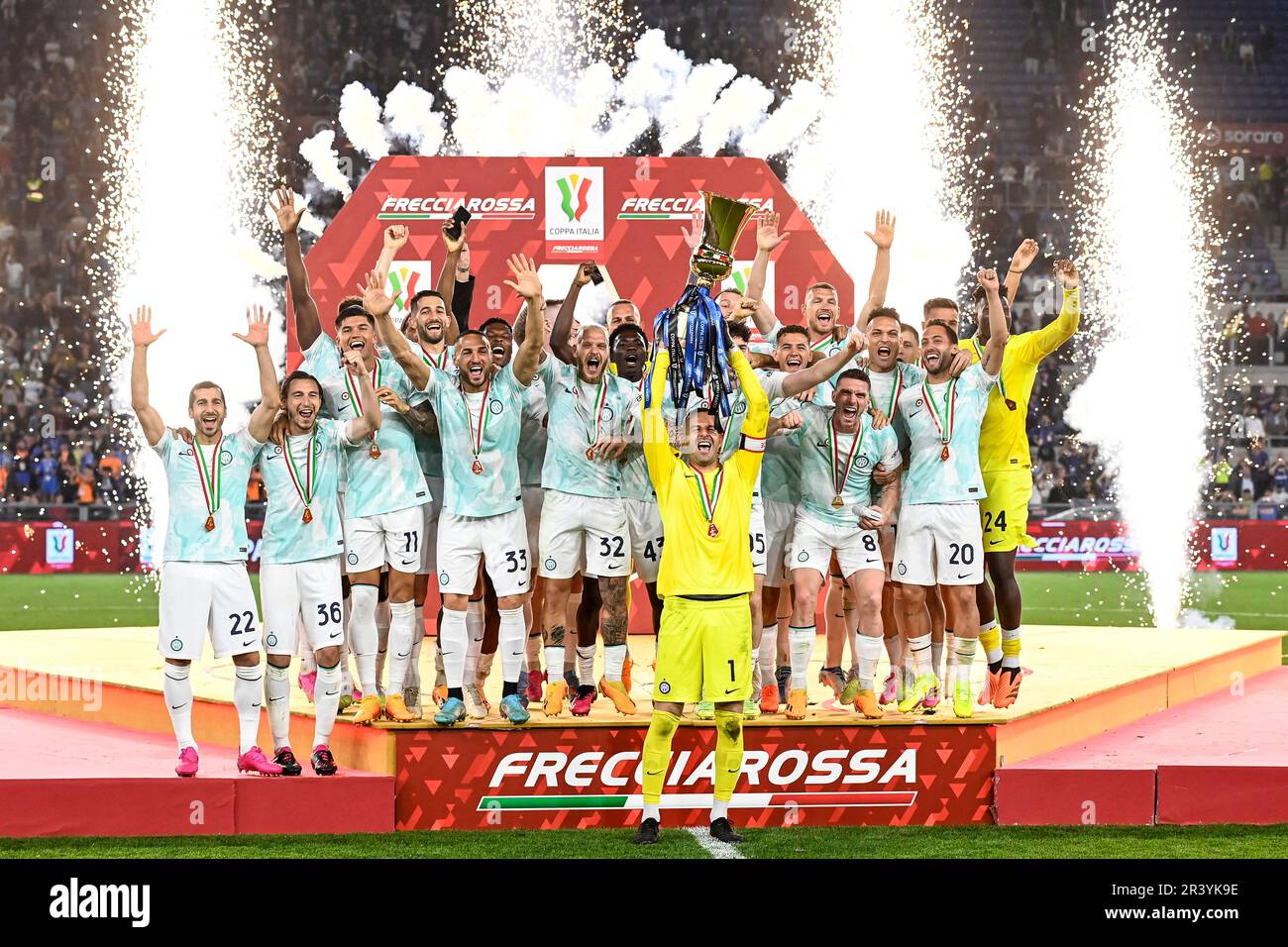 Samir Handanovic of Fc Internazionale lifts the trophy as he celebrates ...