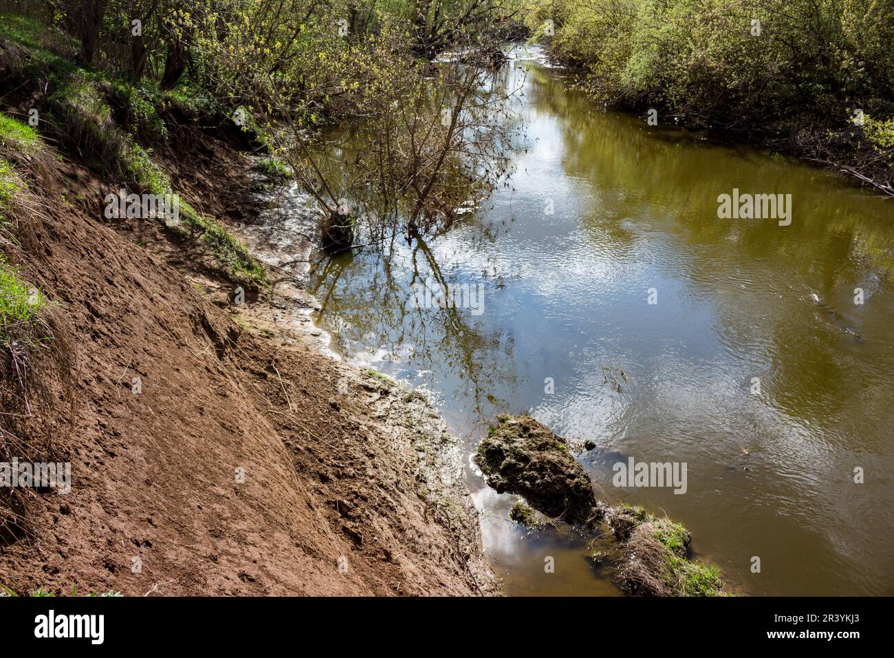View of the landslide of the clay bank on the river Stock Photo - Alamy