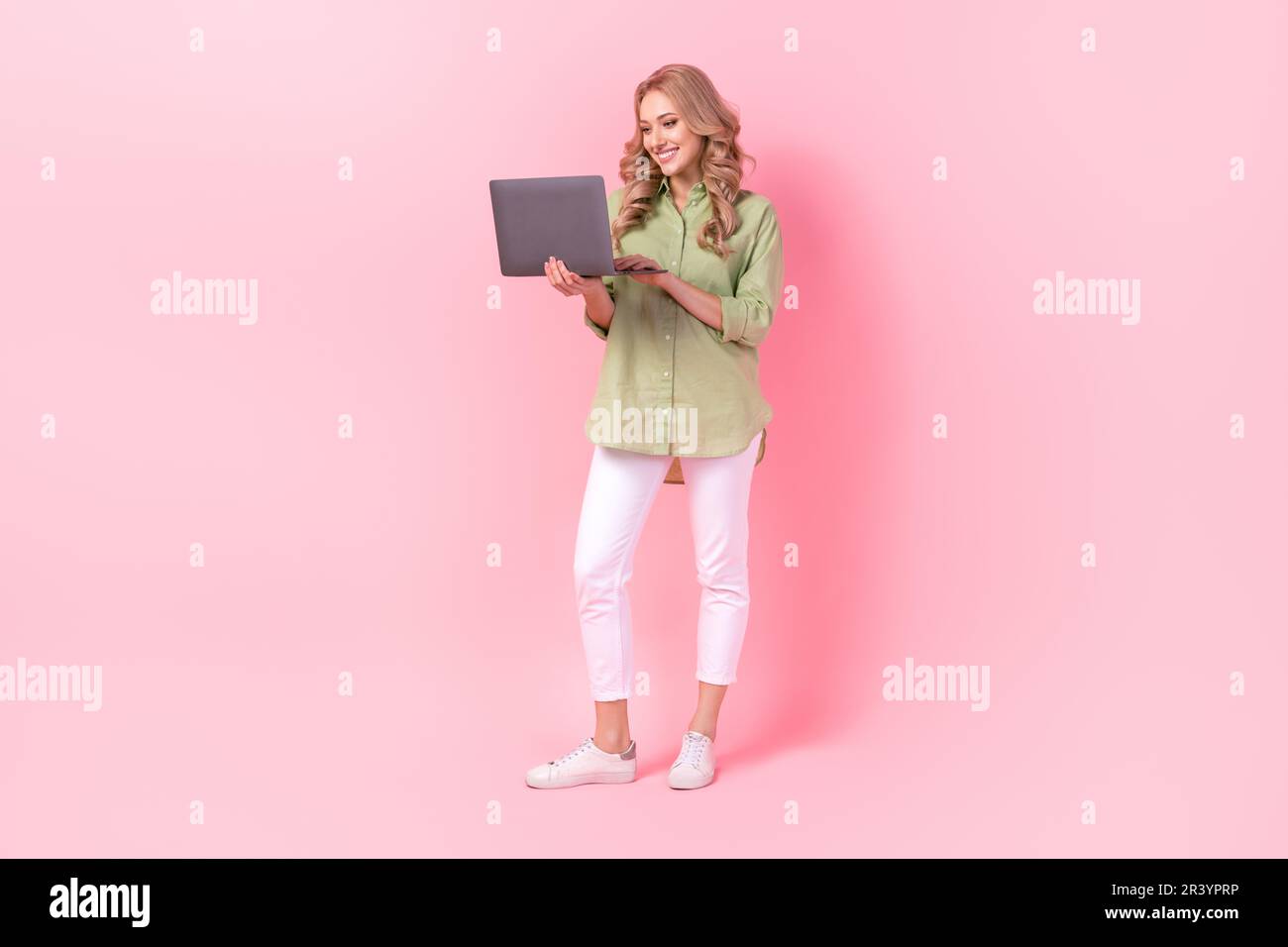 Full length photo of pretty shiny lady wear green shirt texting ...
