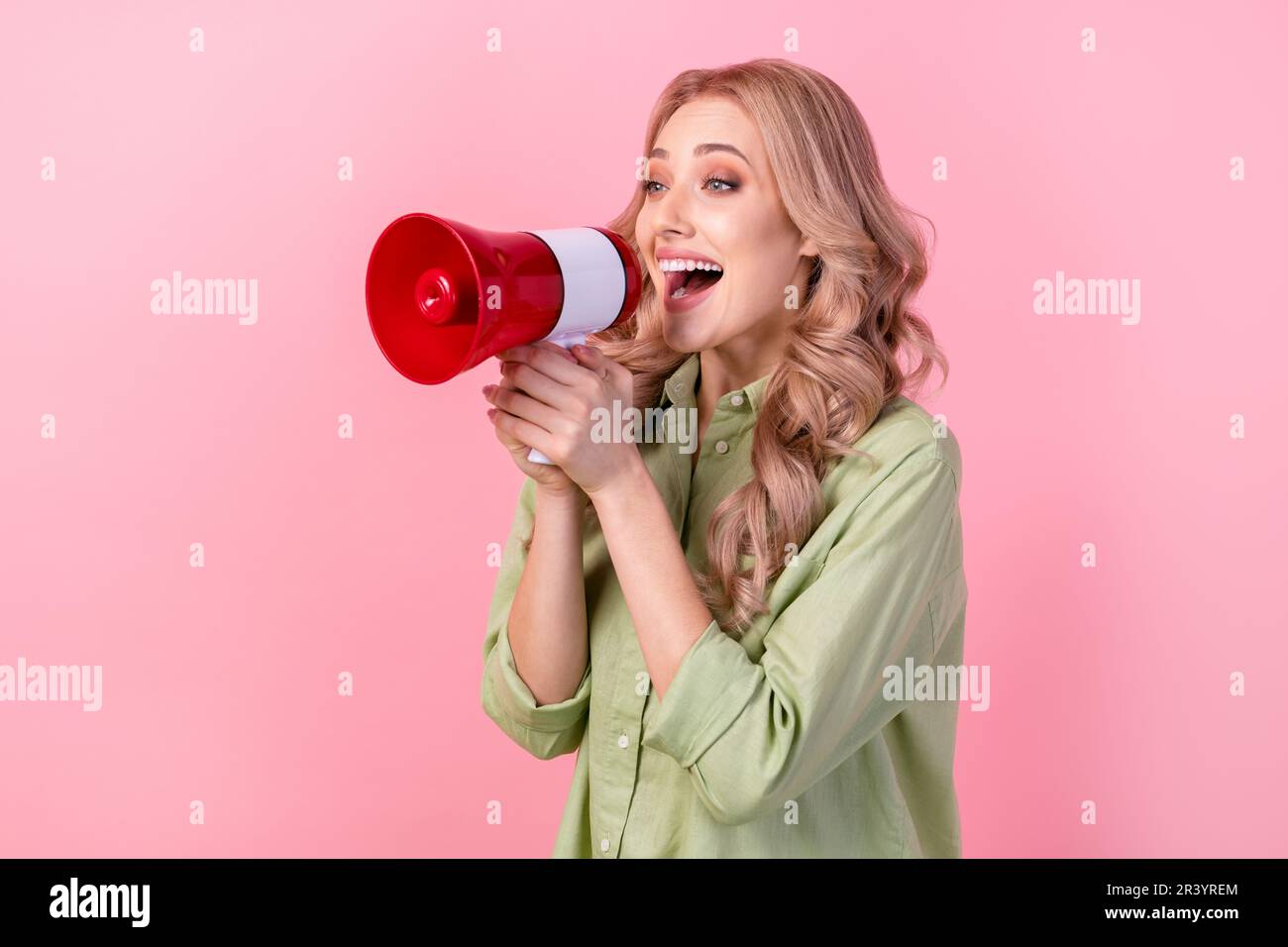 Photo of charming excited lady wear green shirt screaming bullhorn ...